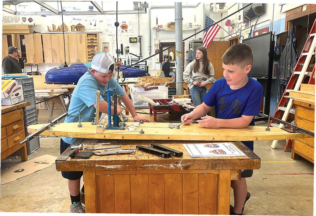 Derby racers prepare cars